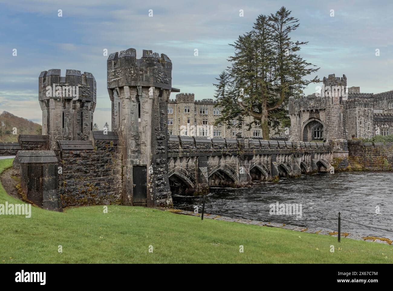An ancient bridge with archways leading to a castle Stock Photo - Alamy