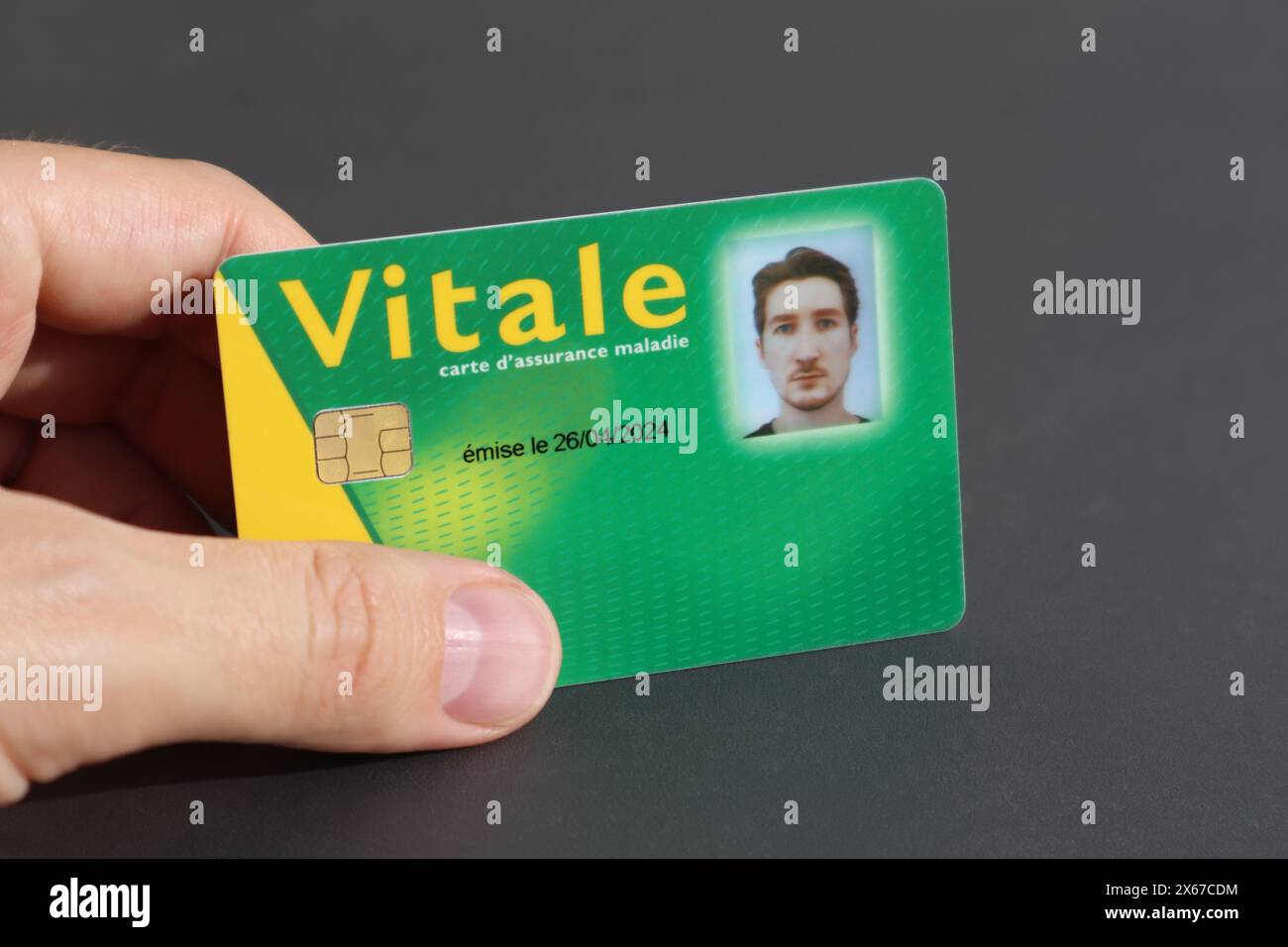 Young man's health insurance card of the national health care system in ...