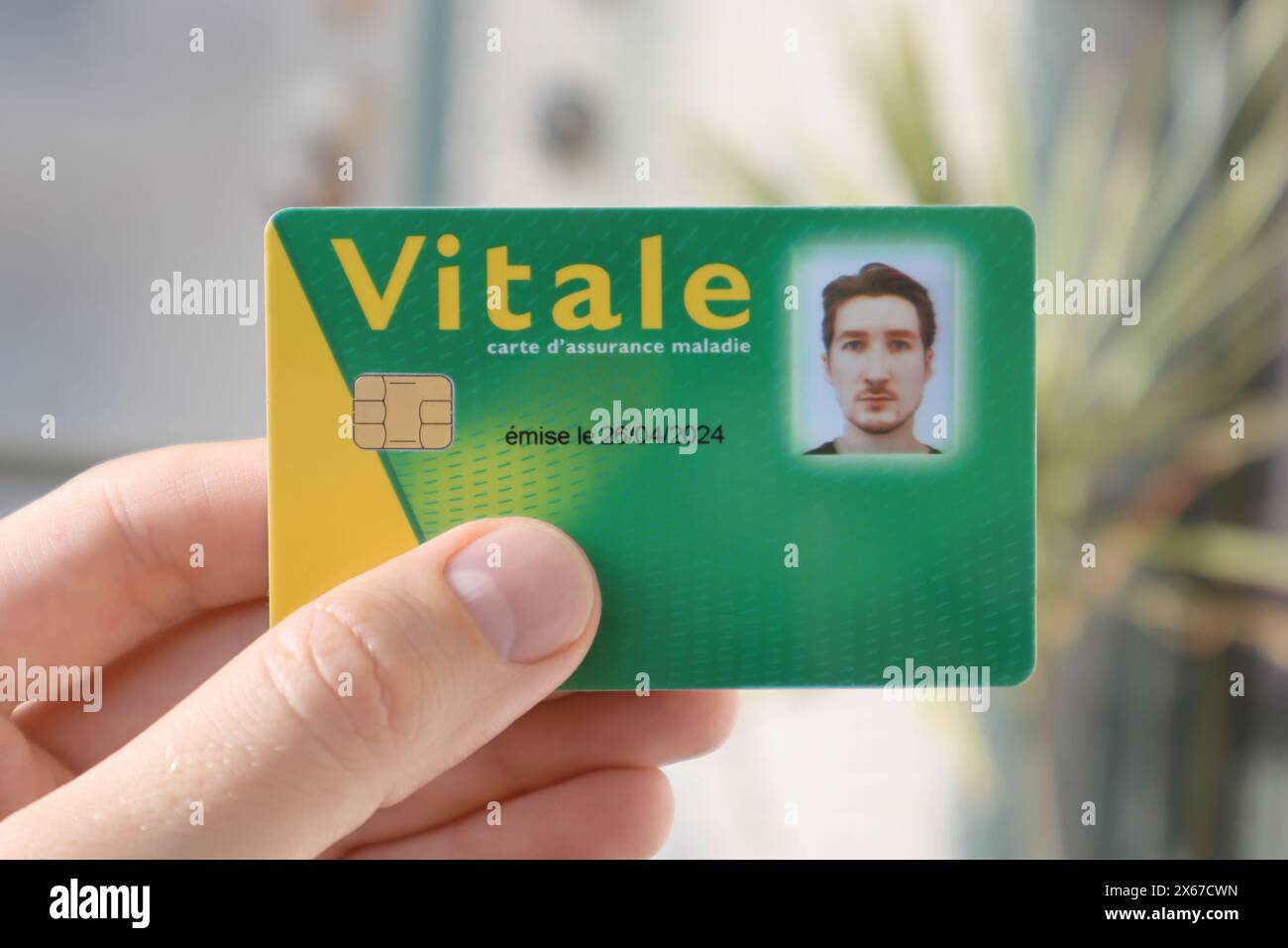 Young man's health insurance card of the national health care system in ...