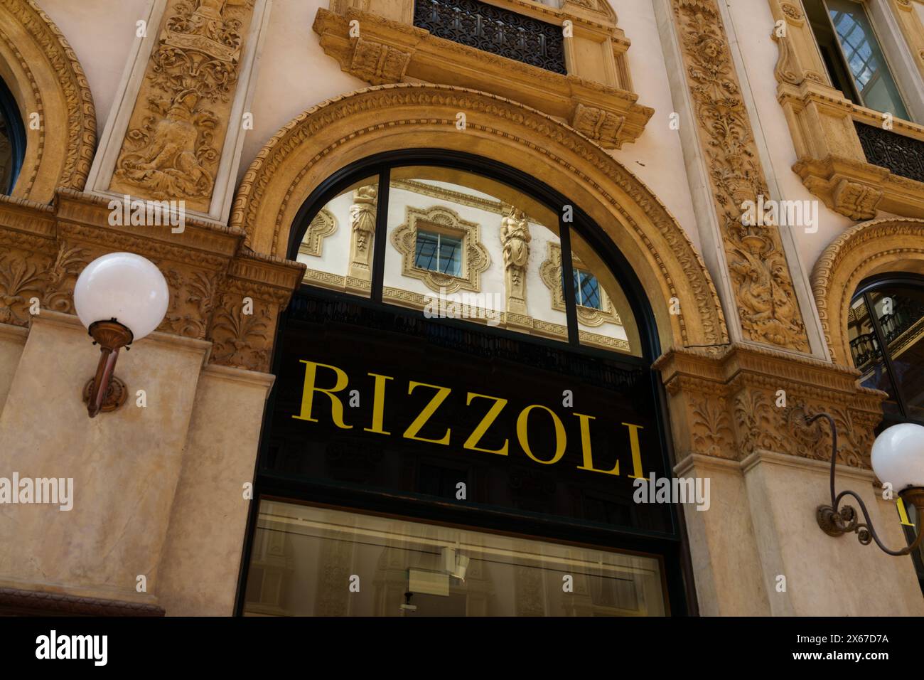 Milan, Italy - 24.04.2024: Rizzoli showcase located at shopping gallery ...