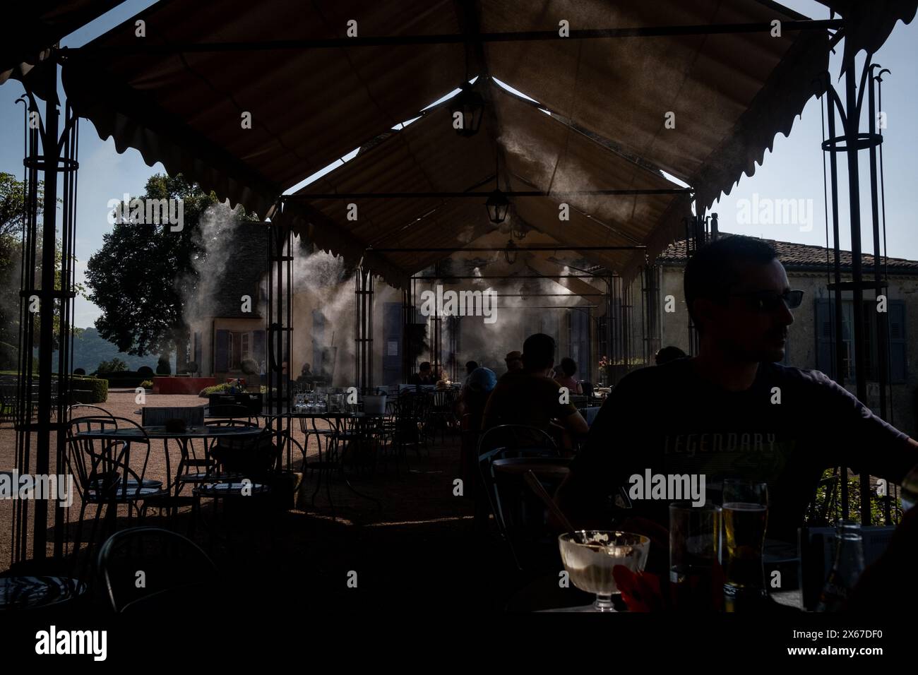 Cafe bar restaurant with misters to reduce the heat during a tourist ...