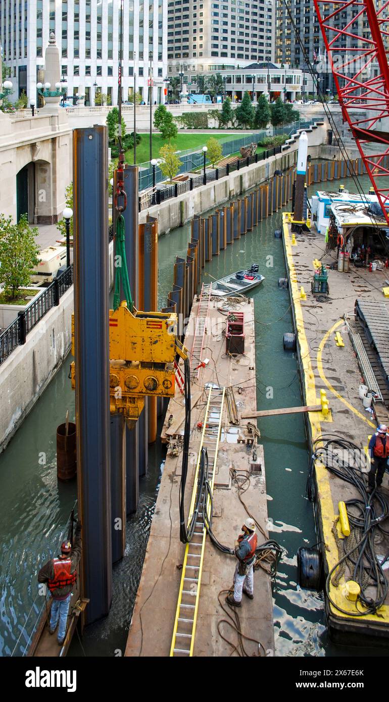 Worker on riverside construction Stock Photo - Alamy