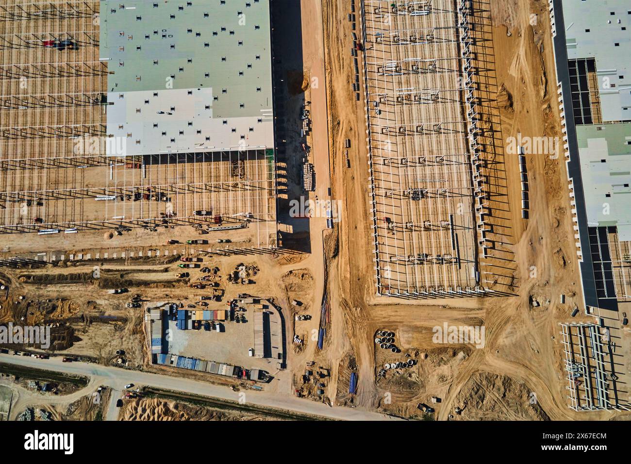Aerial view of construction site with warehouse building under ...