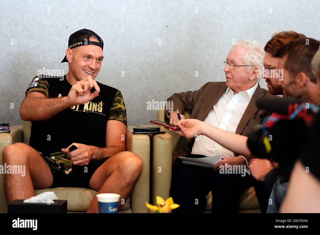Boxer Tyson Fury (left) during a media day in Riyadh. The IBF, WBA, WBC ...