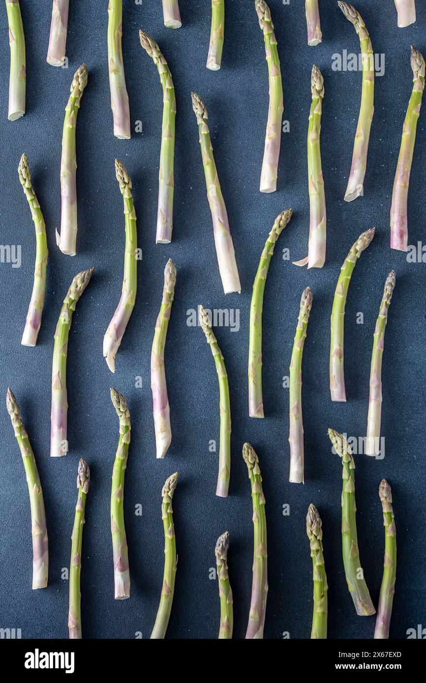 Green asparagus pattern on background. Vegetable sprouts stems. Fresh ...