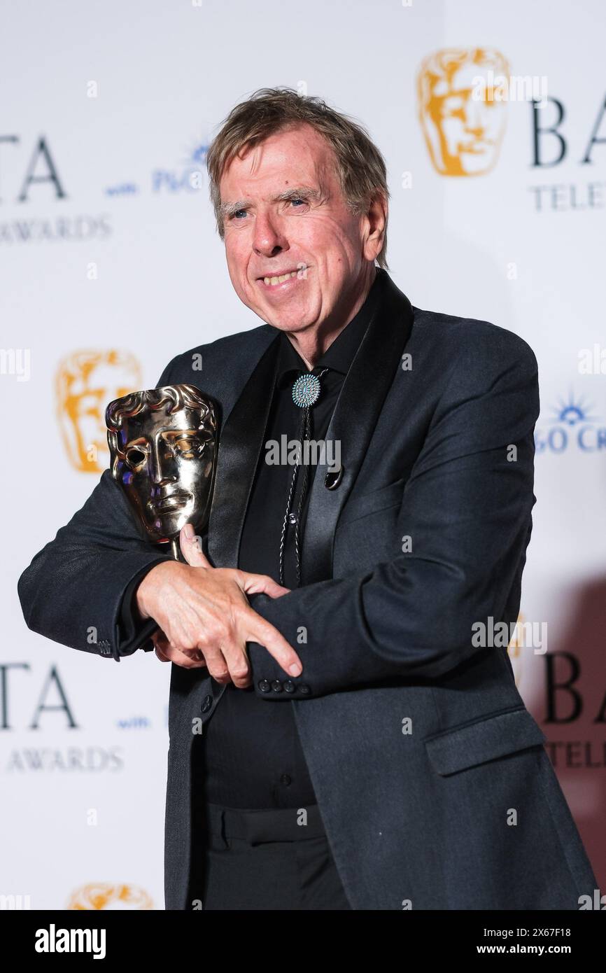 Timothy spall poses with his leading actor bafta hi-res stock ...