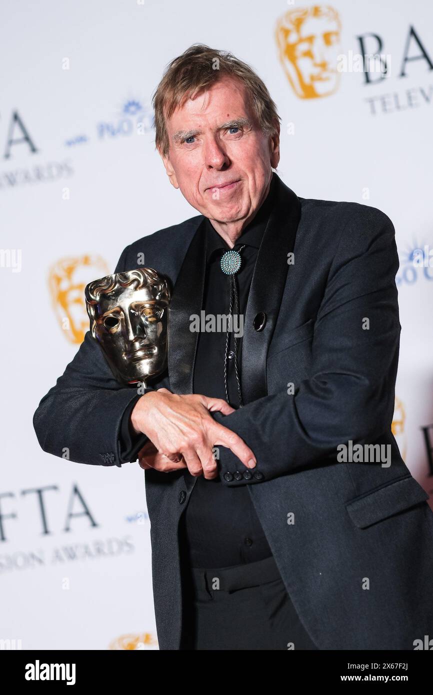 Timothy spall poses with his leading actor bafta hi-res stock ...