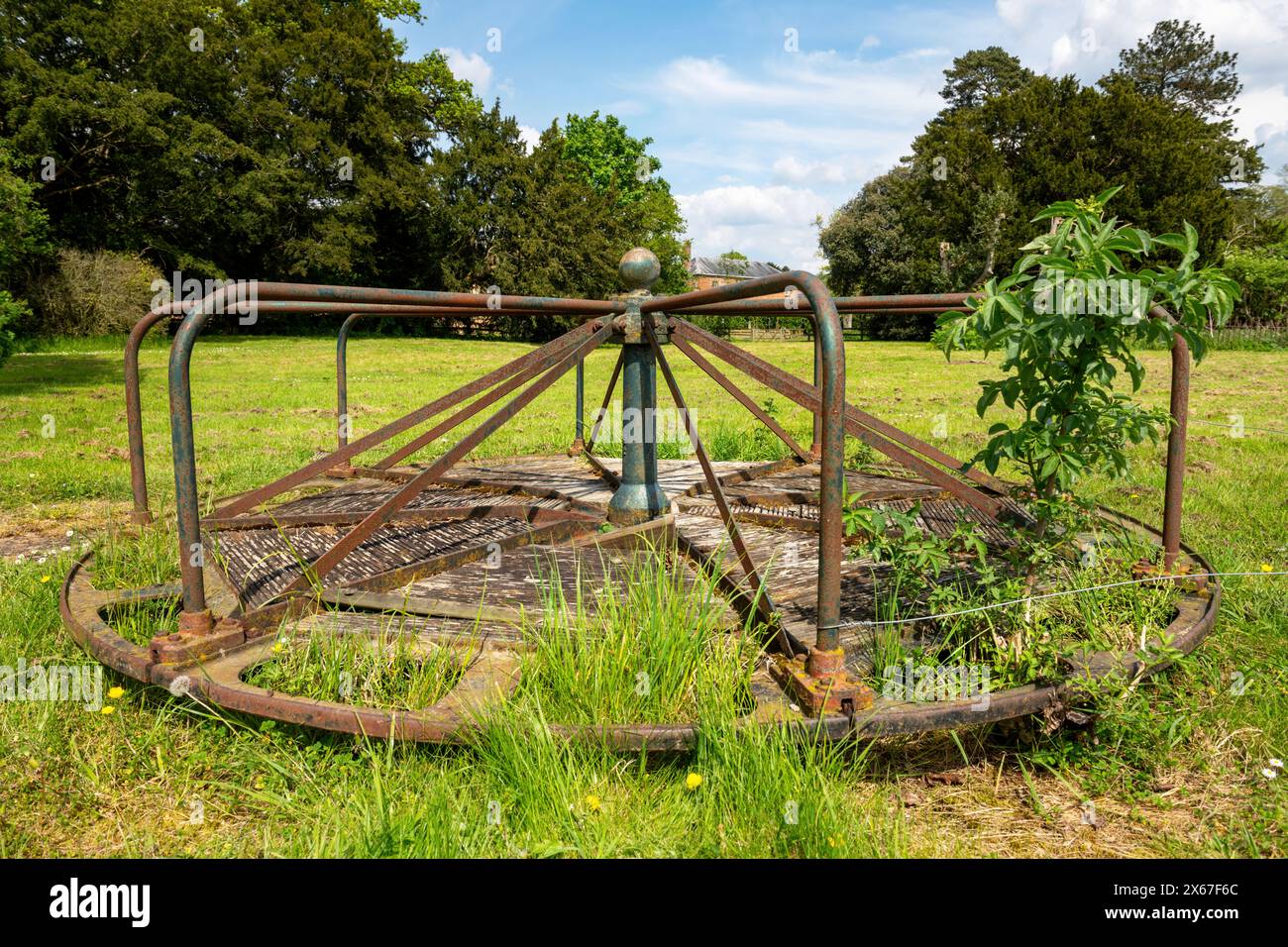 An old dilapidated and disused children's roundabout, situated at ...