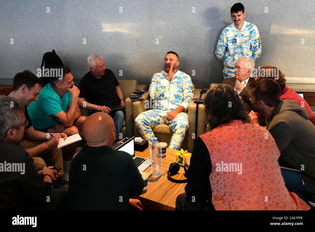 Boxer Oleksandr Usyk (centre) during a media day in Riyadh. The IBF ...