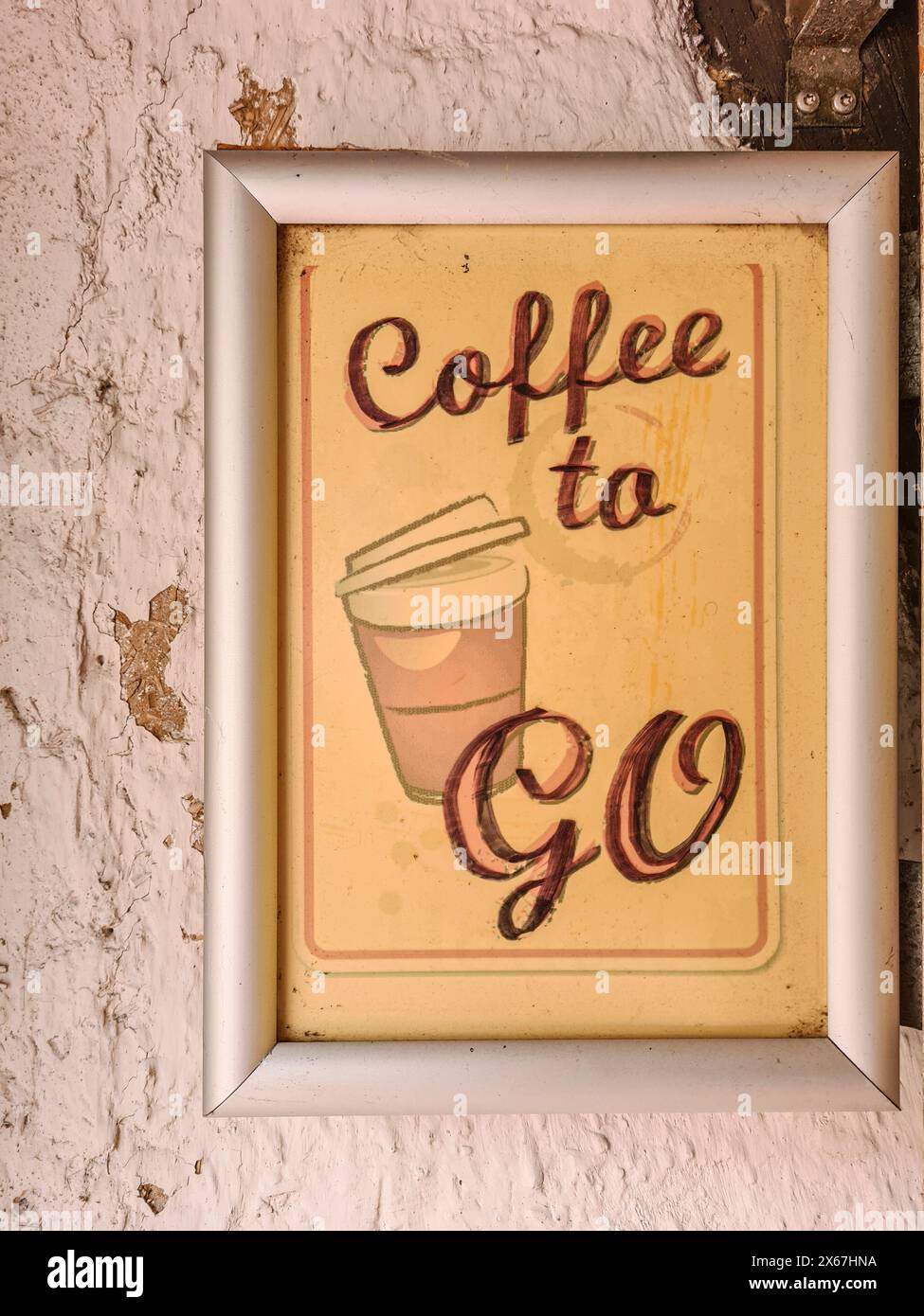 Homemade advertising sign in a picture frame for takeaway coffee on a ...