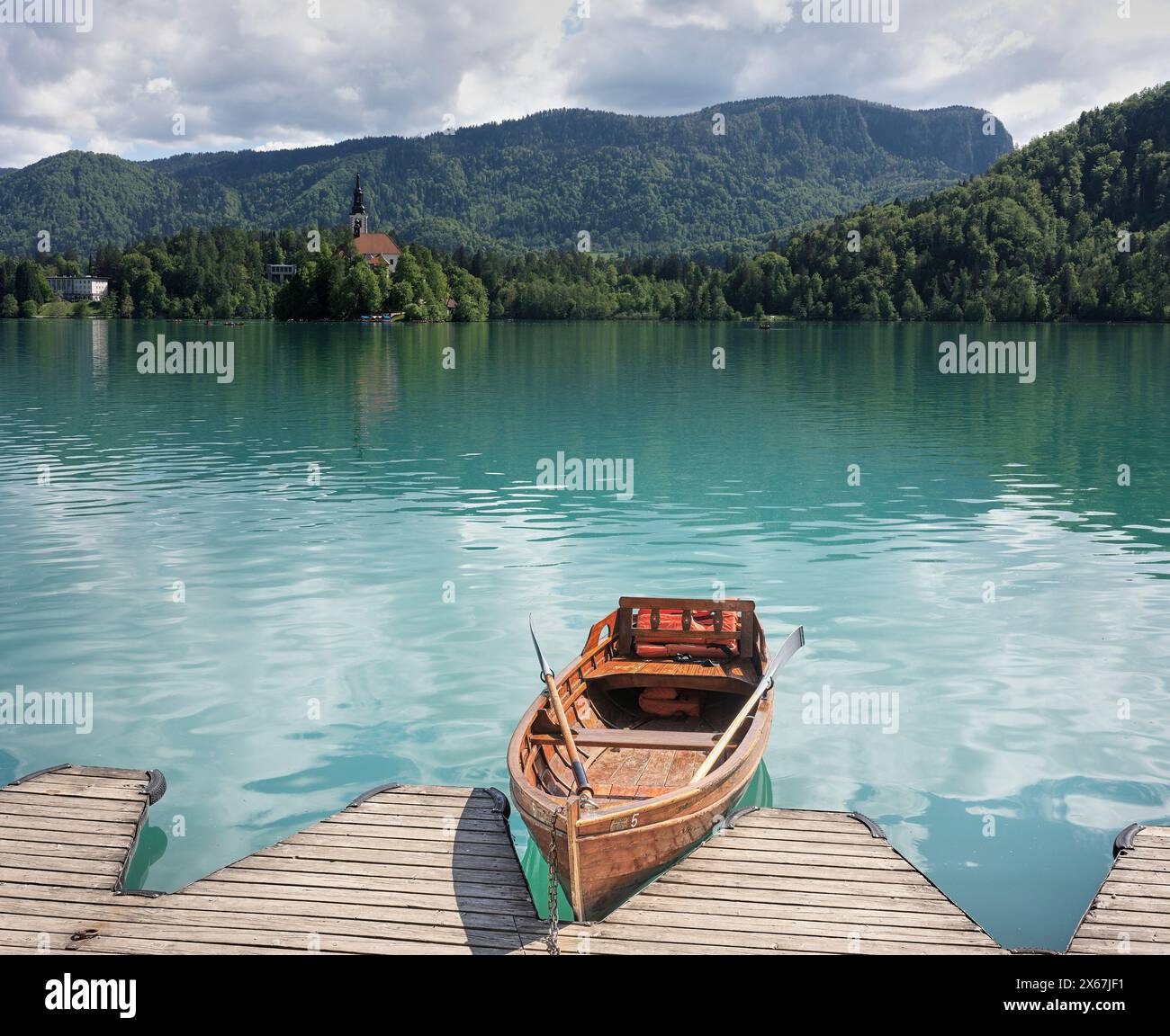 Vacant pletna rowing boat for a trip to the island on lake Bled, Julian ...