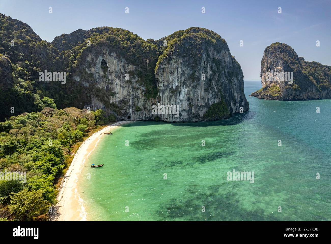 Steep karst cliffs and beach on the islands of Koh Lao Liang, Thailand ...