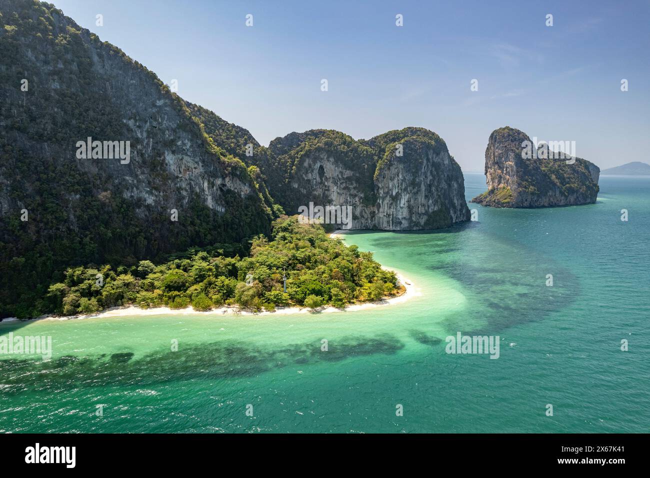 Steep karst cliffs and beach on the islands of Koh Lao Liang, Thailand ...