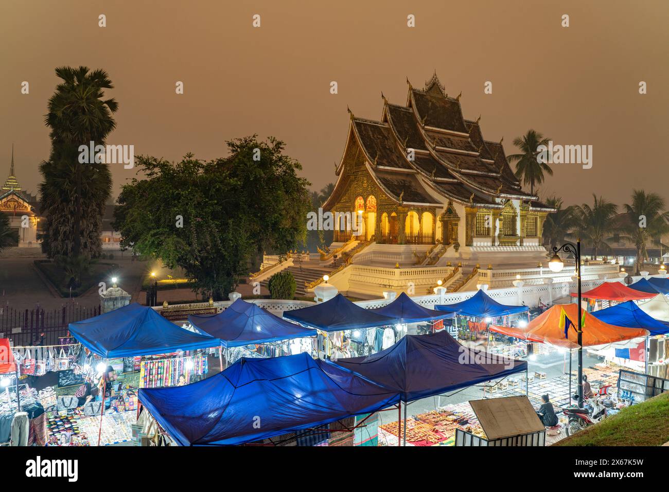 Night market and the Haw Pha Bang temple of the Royal Palace in Luang ...