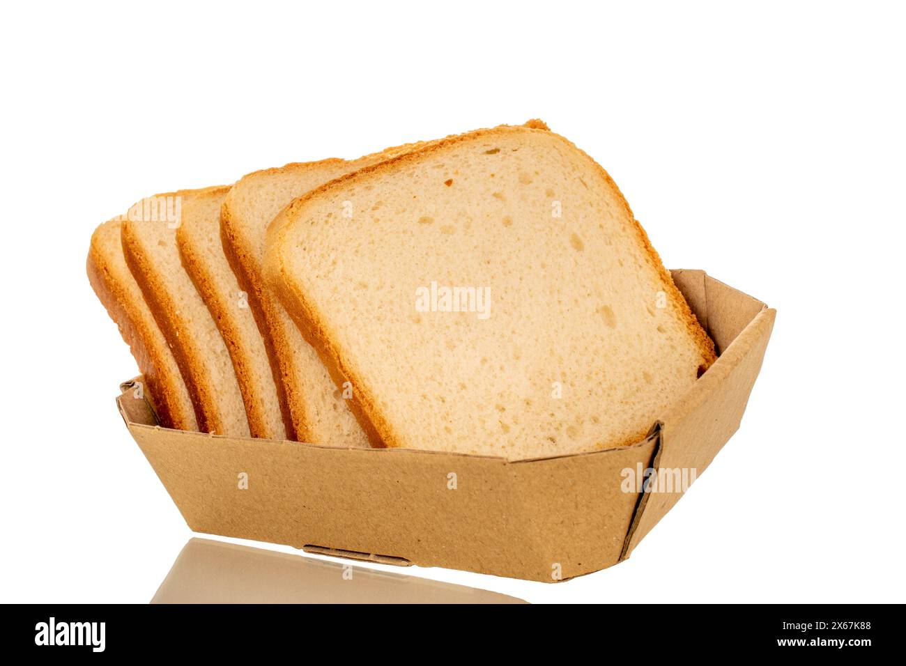 Three slices of white toaster bread on a paper plate, macro, isolated ...