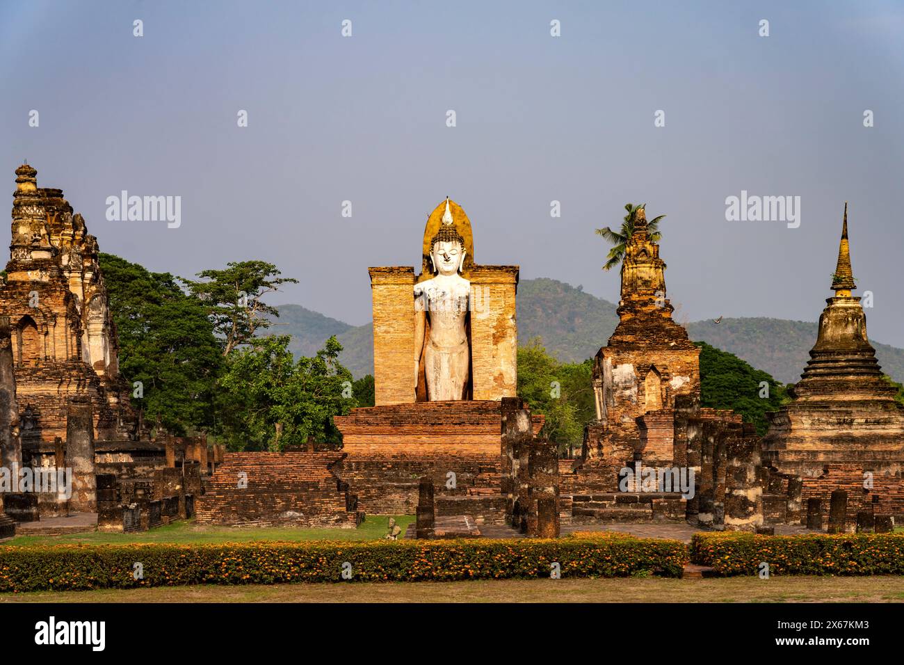 Giant standing Buddha in the Wat Mahathat temple in the UNESCO World ...