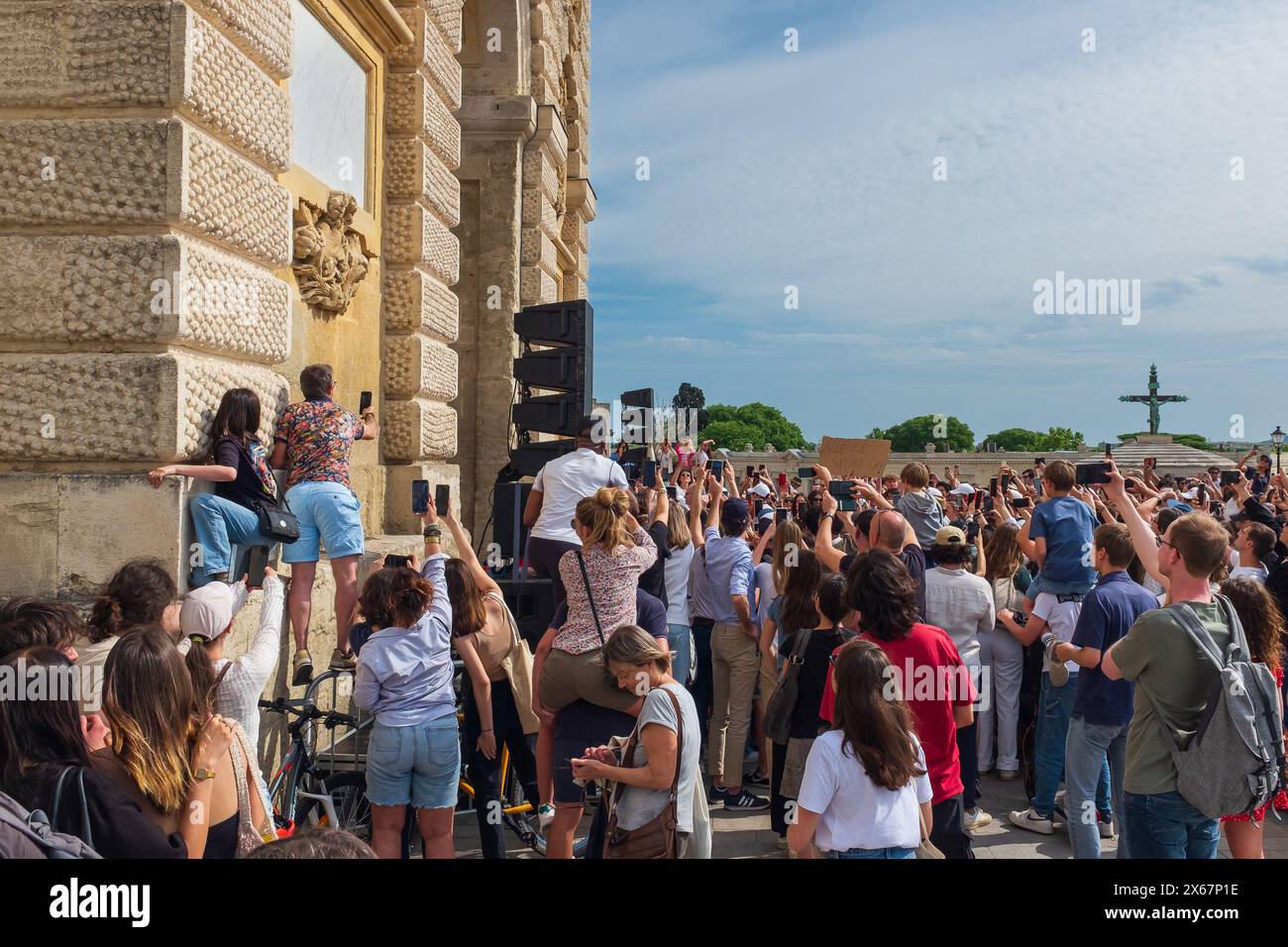 Montpellier, France. 13 May 2024. People climbing the Arch of Triumph ...