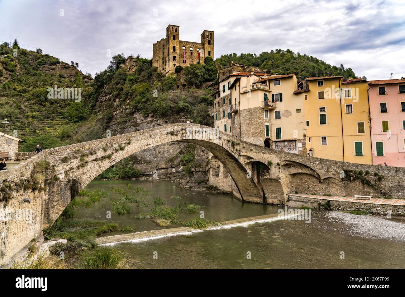 The old Nervia bridge Ponte Vecchio di Dolceacqua and the castle ...