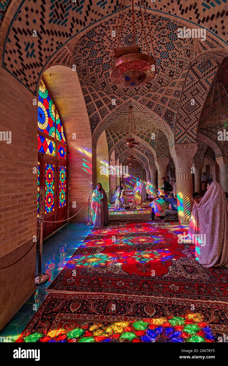 Tourists take pictures inside the 19th century Nasir al-Mulk Mosque ...
