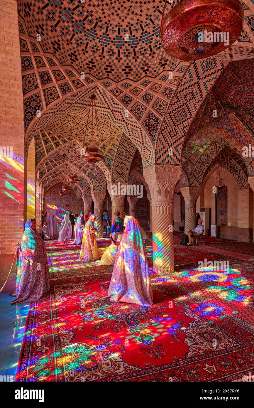Tourists take pictures inside the 19th century Nasir al-Mulk Mosque ...