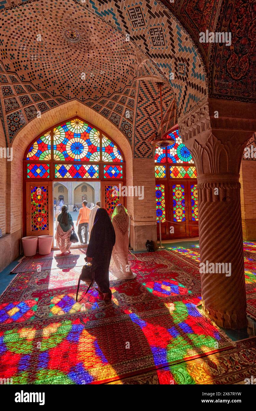 Tourists walk out of the 19th century Nasir al-Mulk Mosque, aka the ...
