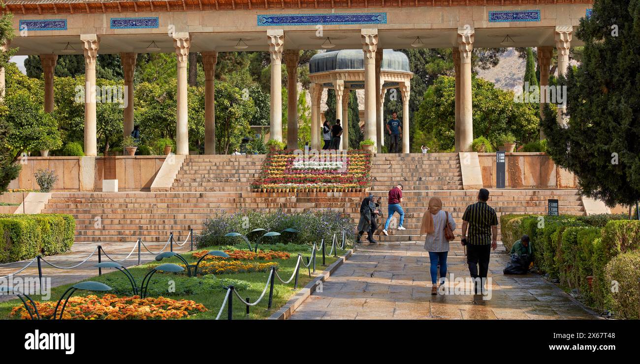People walk in the landscaped garden at the Tomb of Hafez, one of the ...