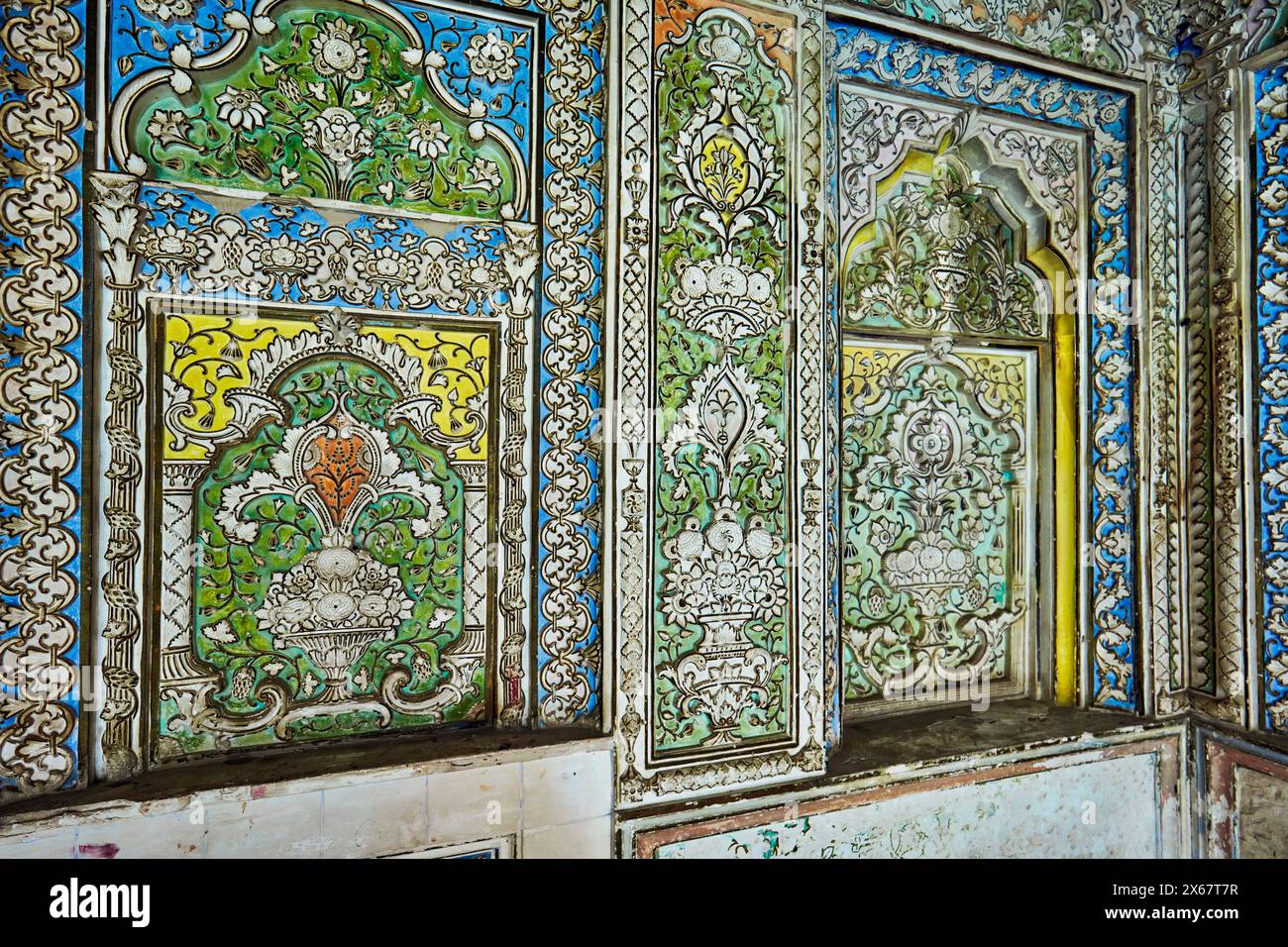 Interior wall decorated with elaborate stuccowork in the Zinat Al-Molk ...