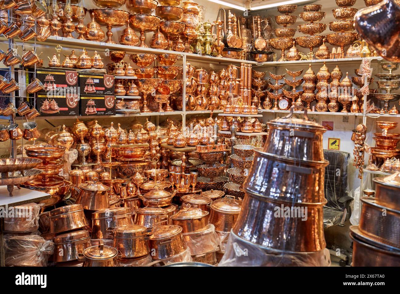 Handmade copper utensils and decorative items displayed in a handicraft ...