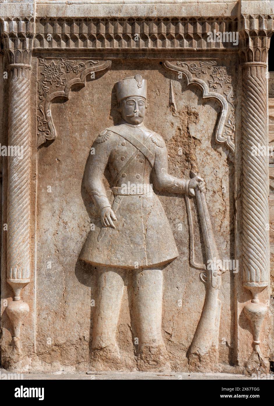 Relief depicting a 19th century Persian soldier with rifle in Qavam ...