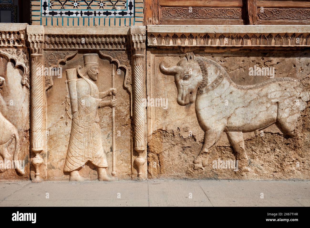 Relief depicting an ancient Persian warrior and a bull in Qavam House ...