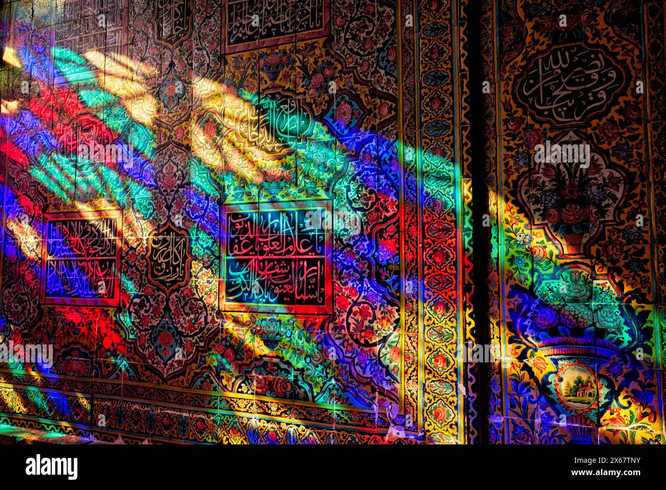 A play of light from multi-colored stained-glass windows inside the ...