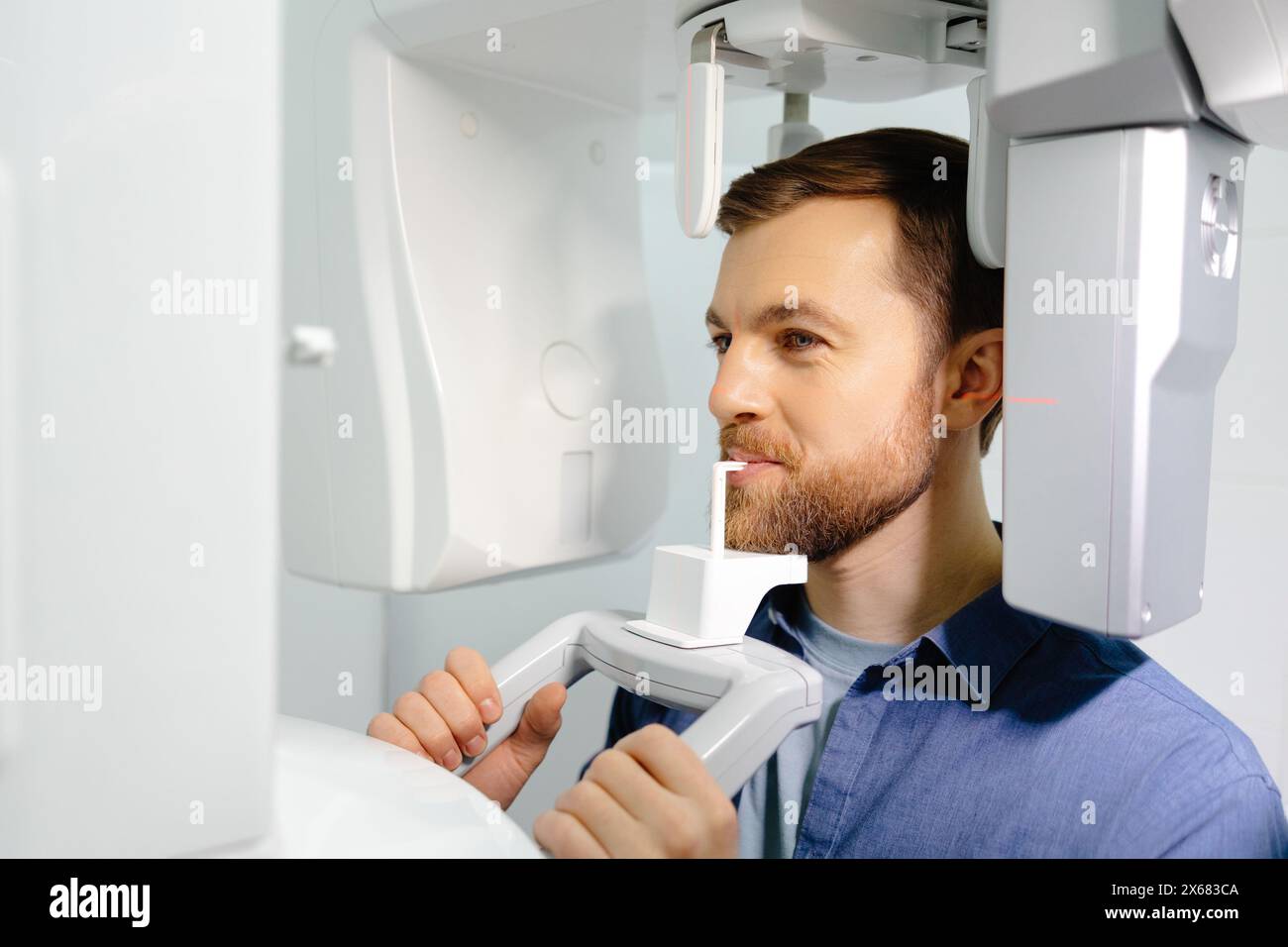 Panoramic image of teeth. A patient in a modern dental clinic takes a ...