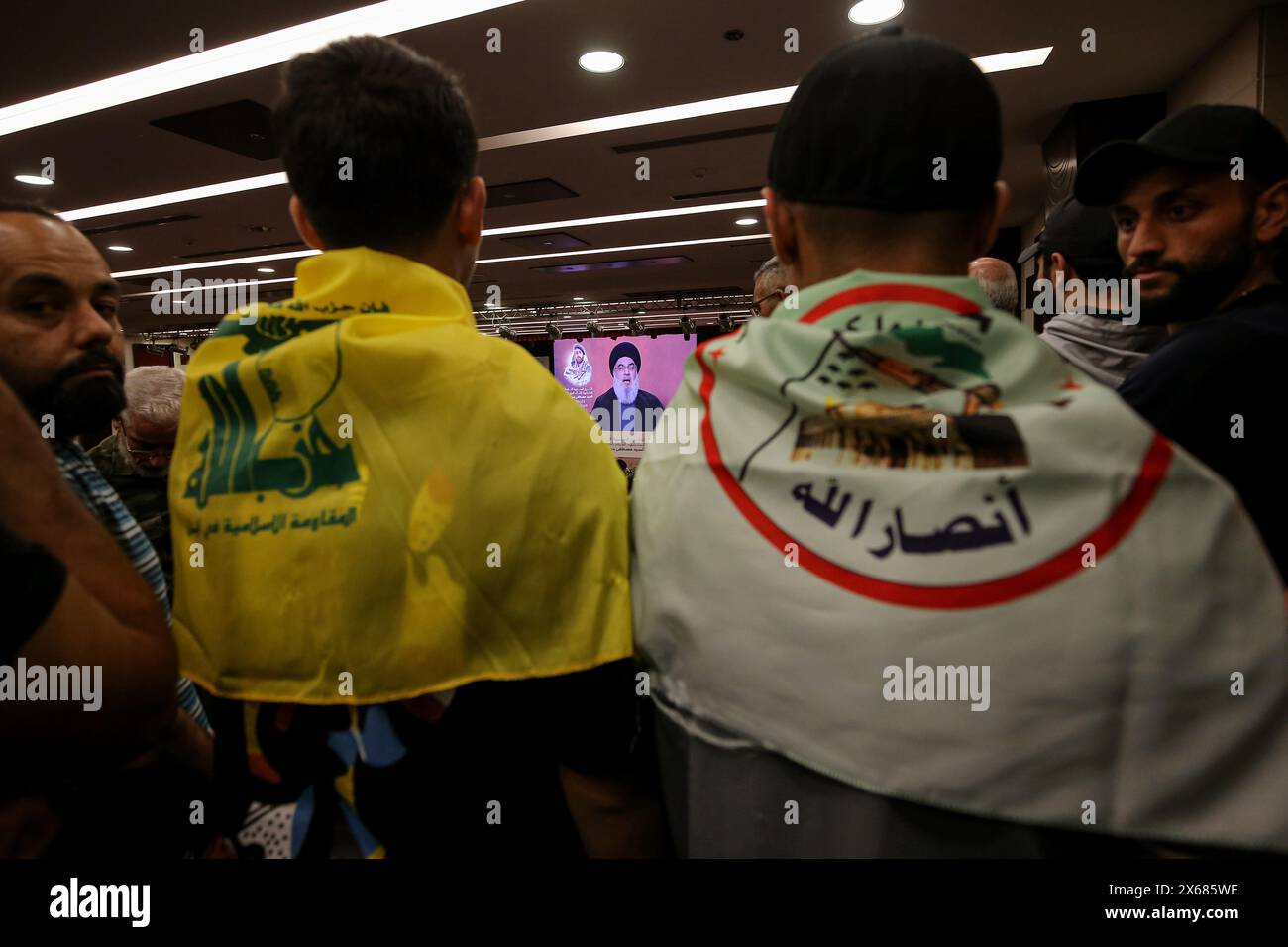 Beirut, Beirut, Lebanon. 13th May, 2024. Two youths, one (L) displaying ...
