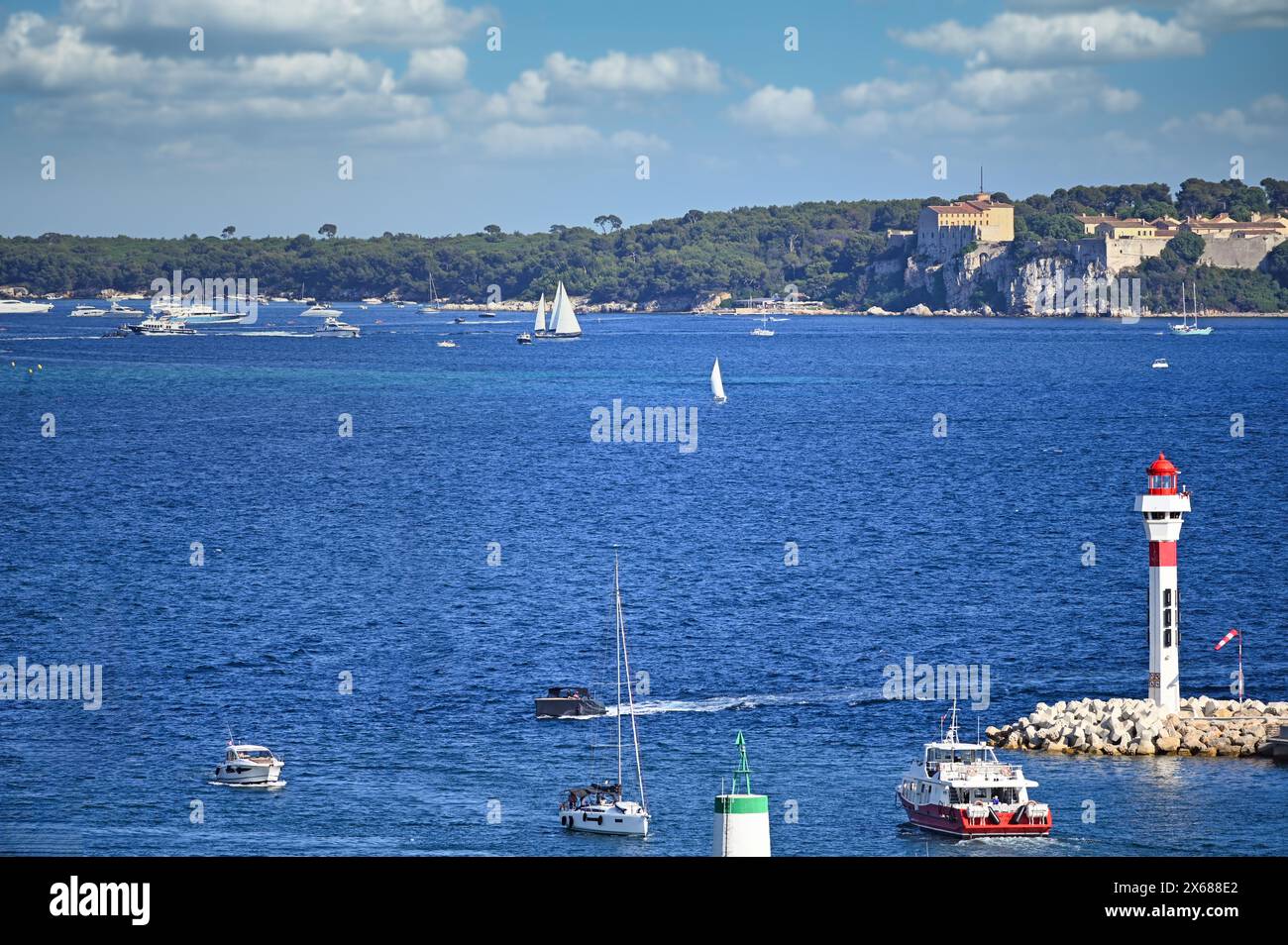 Luxury yachts sailing near port in Cannes city France Stock Photo - Alamy