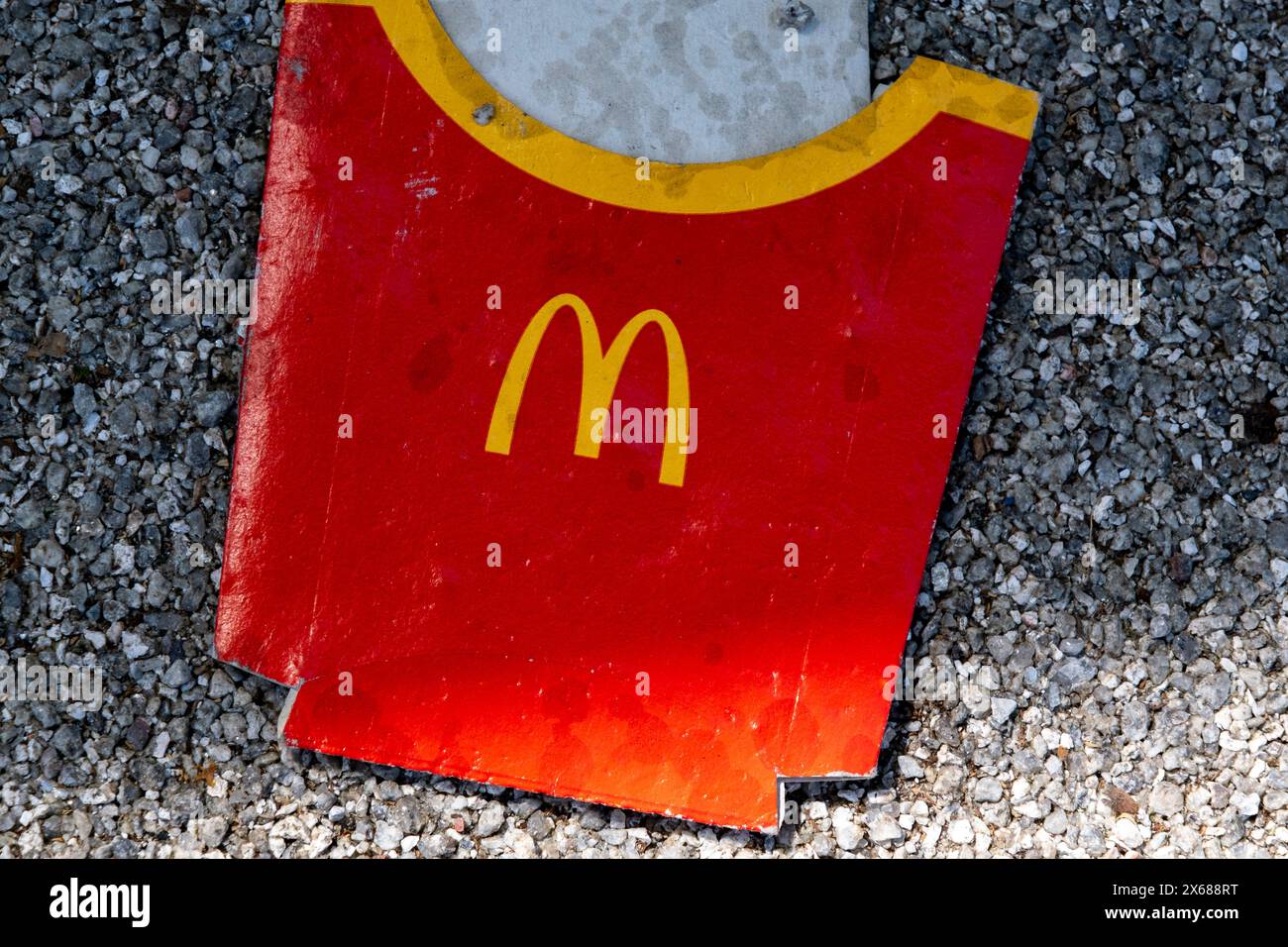 Logo for the McDonalds fast food restaurant on discarded cardboard ...