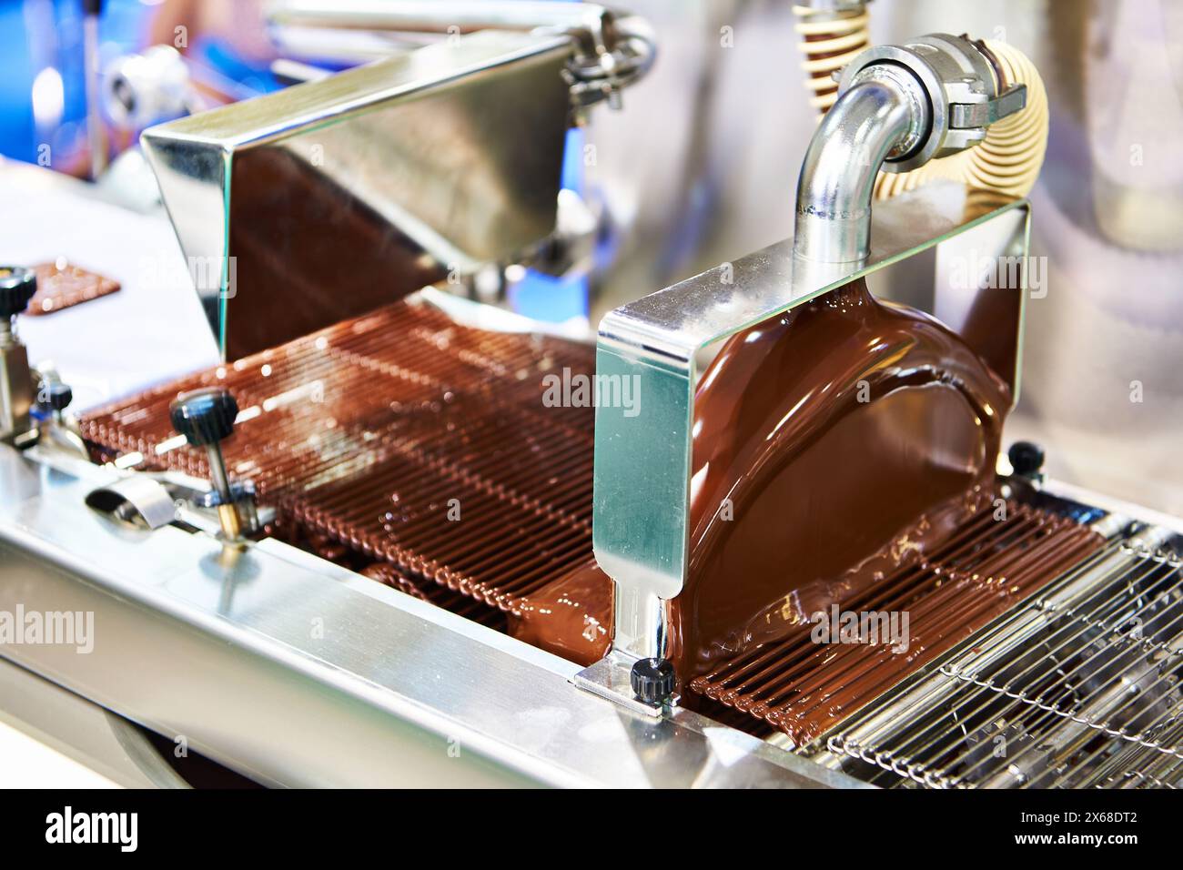Equipment for coating chocolate confectionery Stock Photo - Alamy