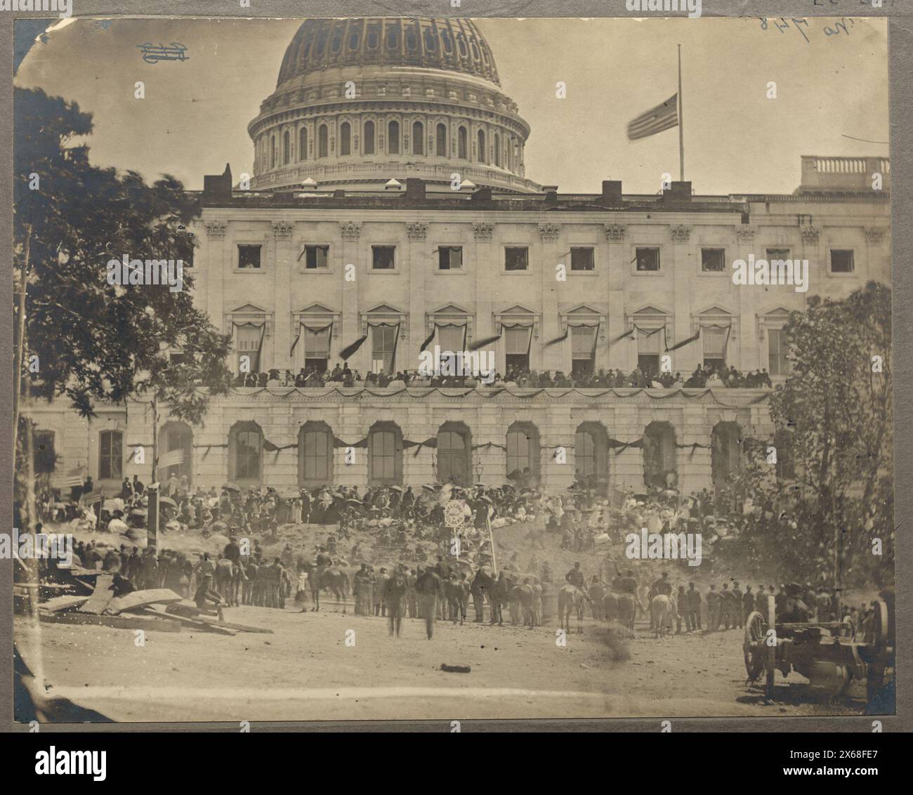 Washington, D.C. Spectators at side of the Capitol, which is hung with ...