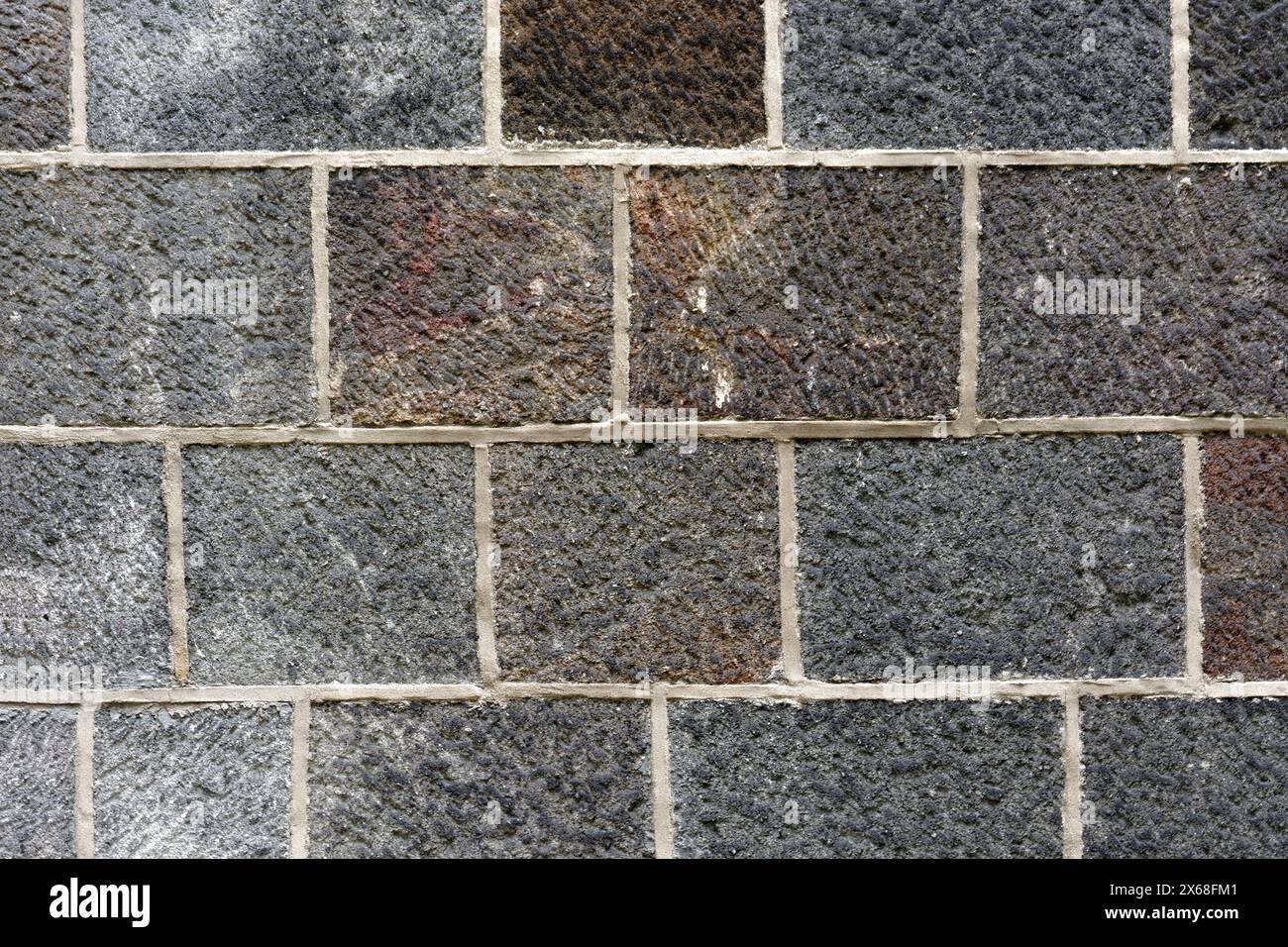Fragment of a gray stone block wall for use as an abstract background ...