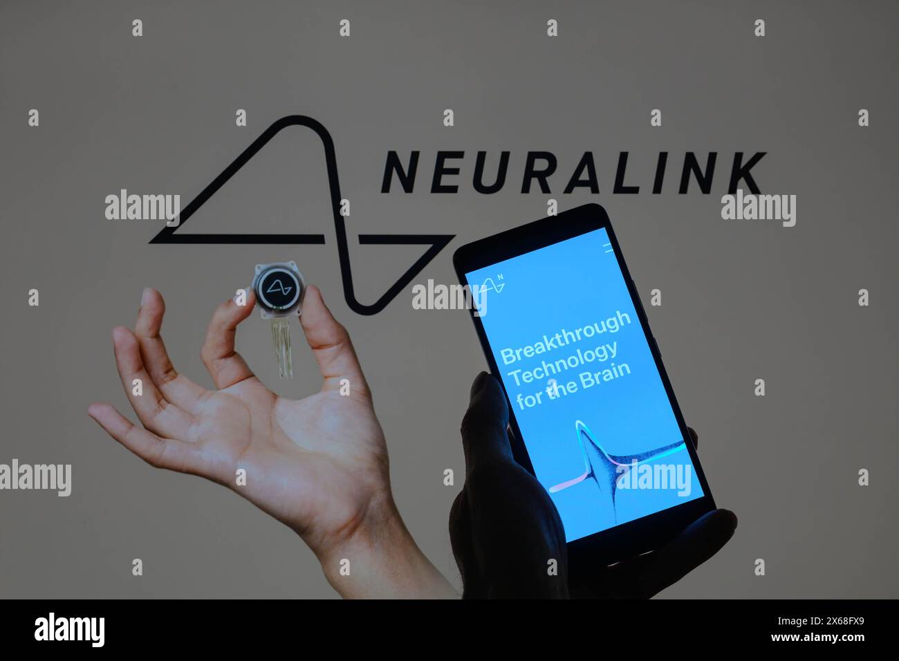Neuralink web site image is displayed on a smartphone with Neuralink ...