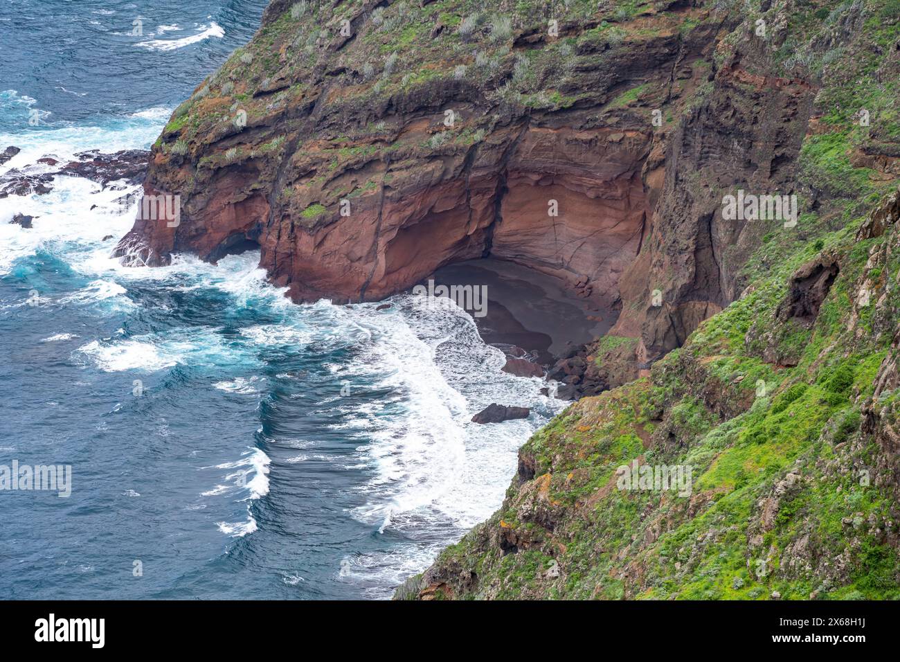 Small bay with black sand at Punta del Fronton, Punta Del Hidalgo ...