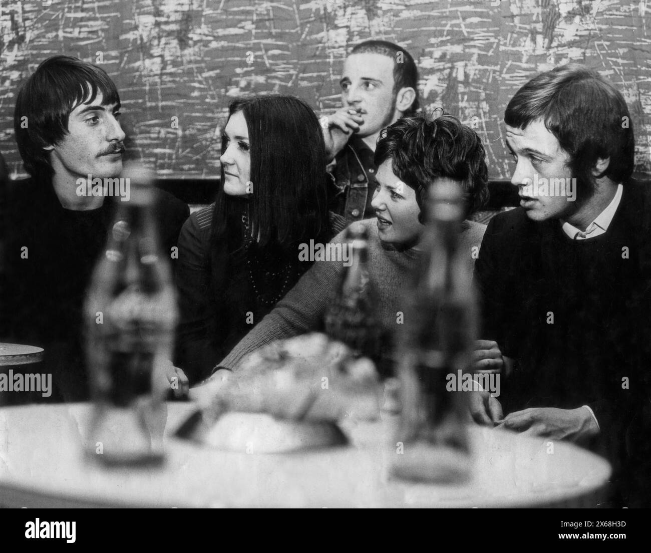 Teenage students at students union event socialising and drinking at ...