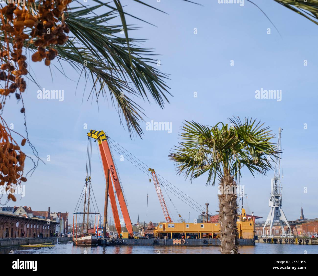 Floating crane transports damaged ship Stock Photo - Alamy