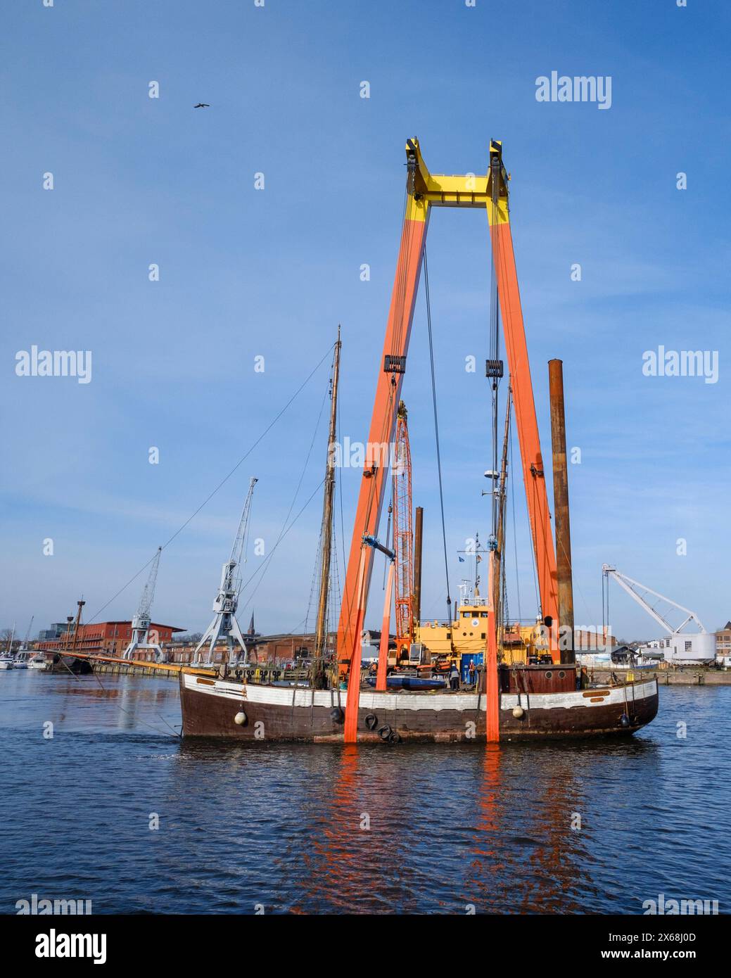 Ship damaged by floating crane Stock Photo - Alamy