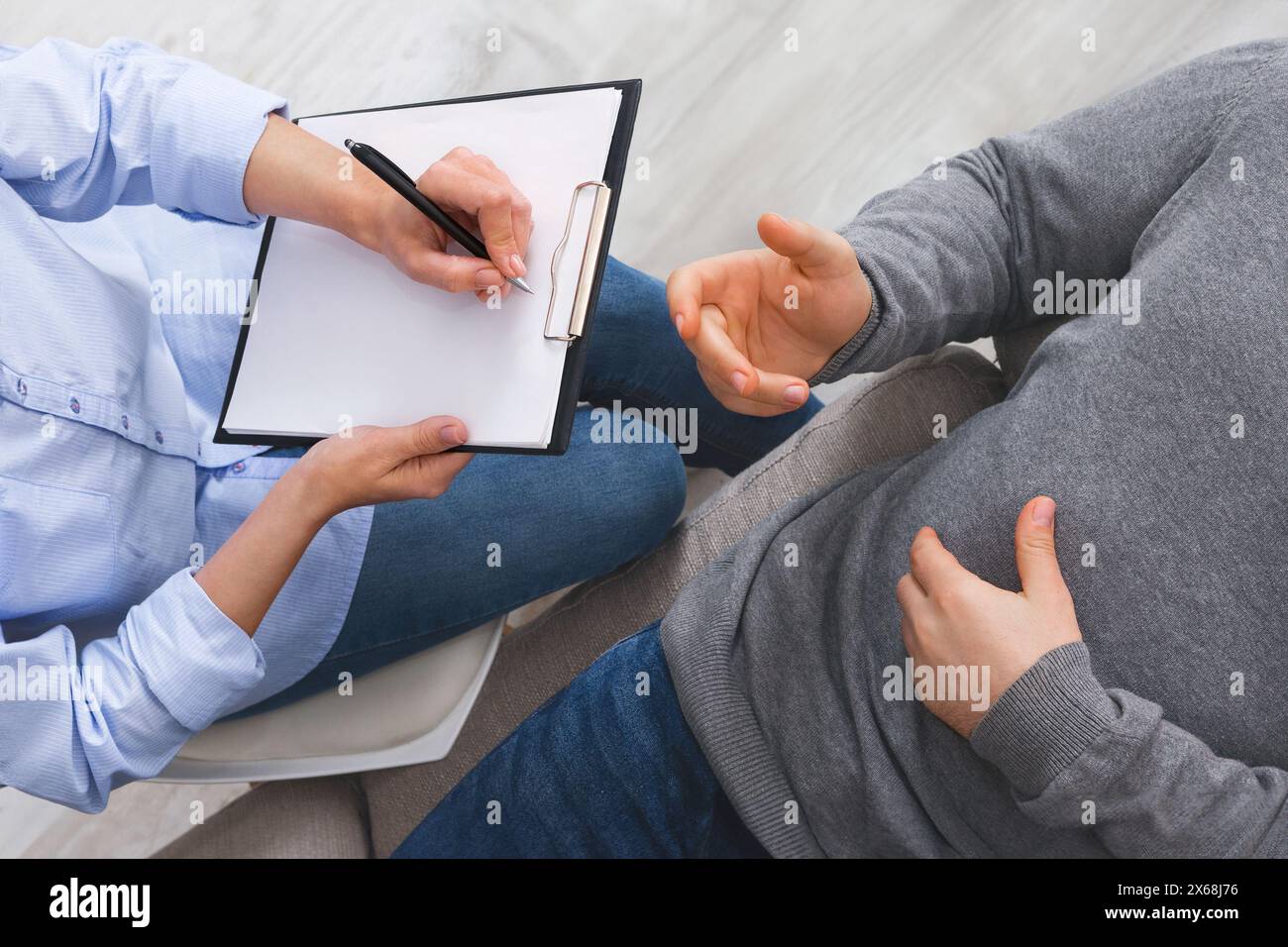 Professional Therapist Conducting Counseling Session With Man Client ...