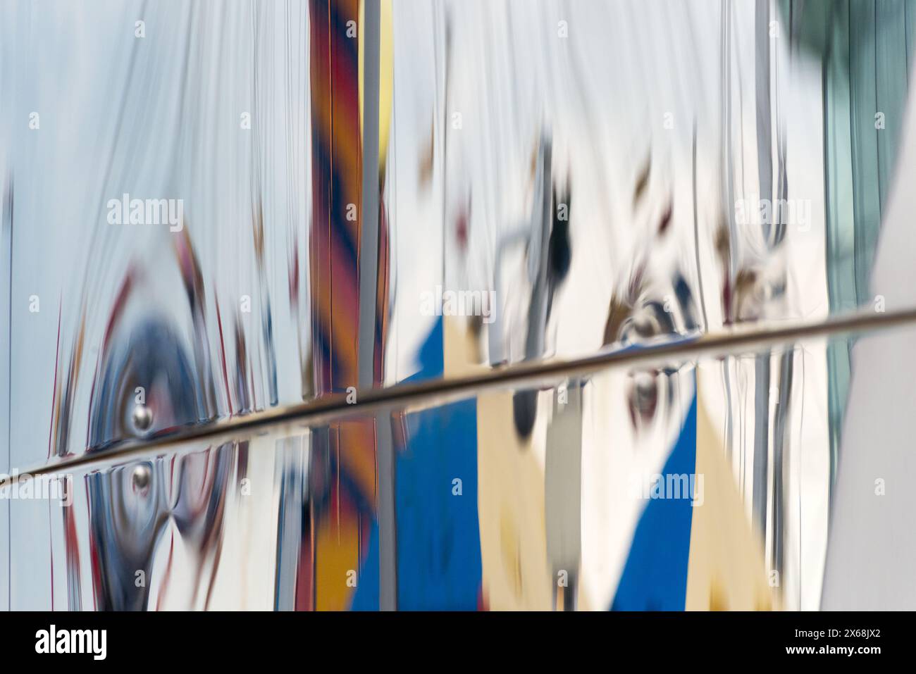 A reflection of a boat is shown in a mirror. The reflection is blurry ...