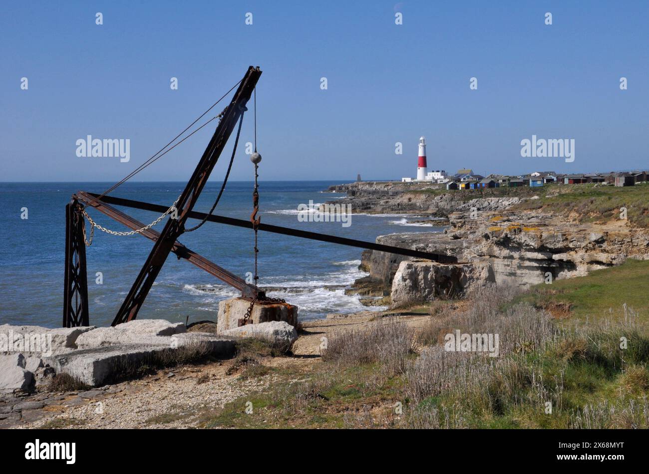 A steel crane on the cliff edge on the Isle of Portland. Originally ...