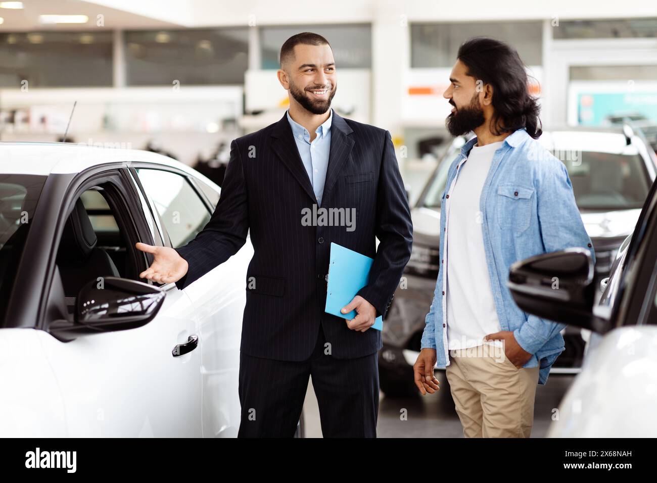 Professional Car Salesman Demonstrating New Vehicle Features to ...