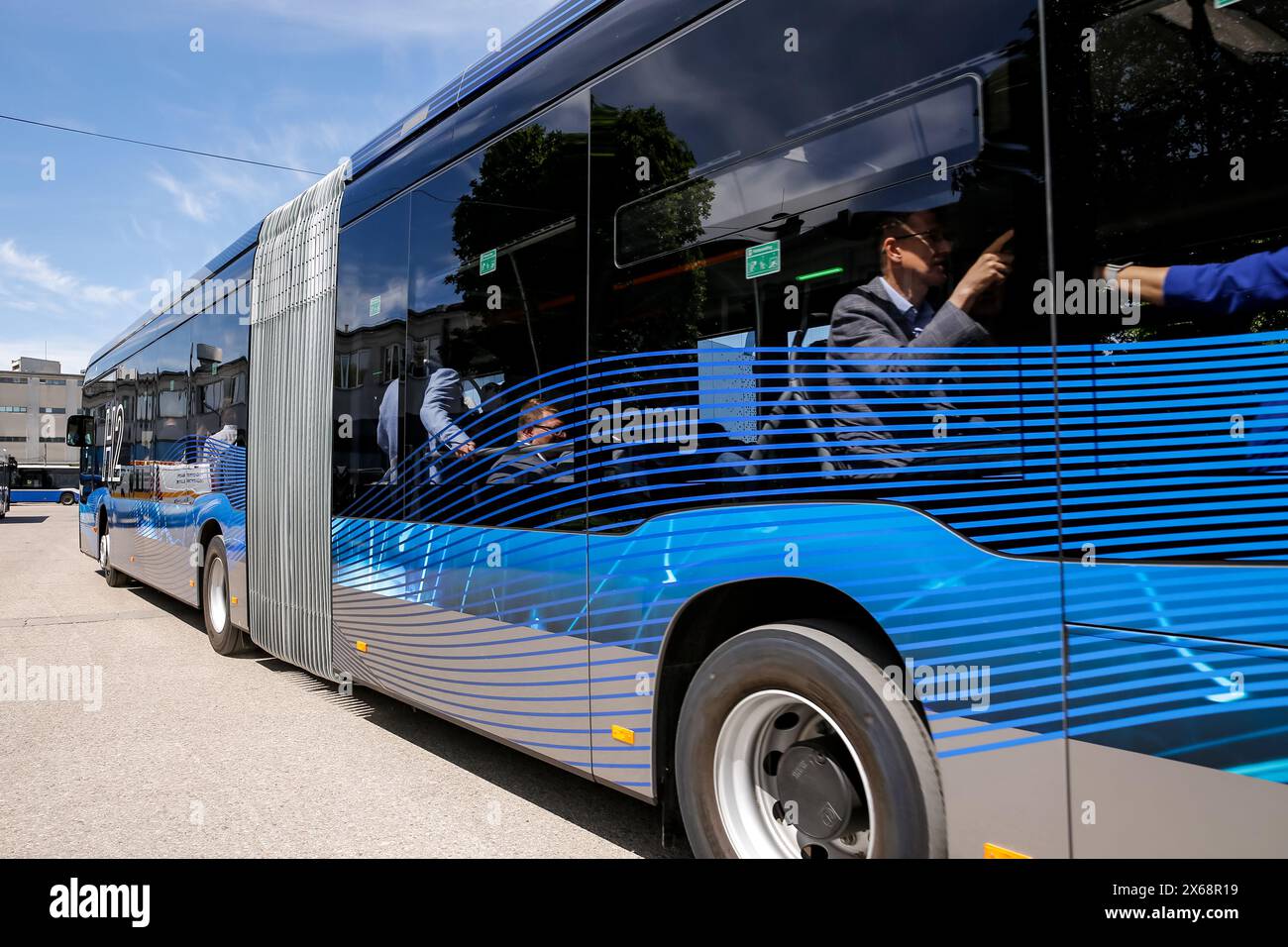 Krakow, Poland. 13th May, 2024. Journalists sit in a hydrogen bus as ...