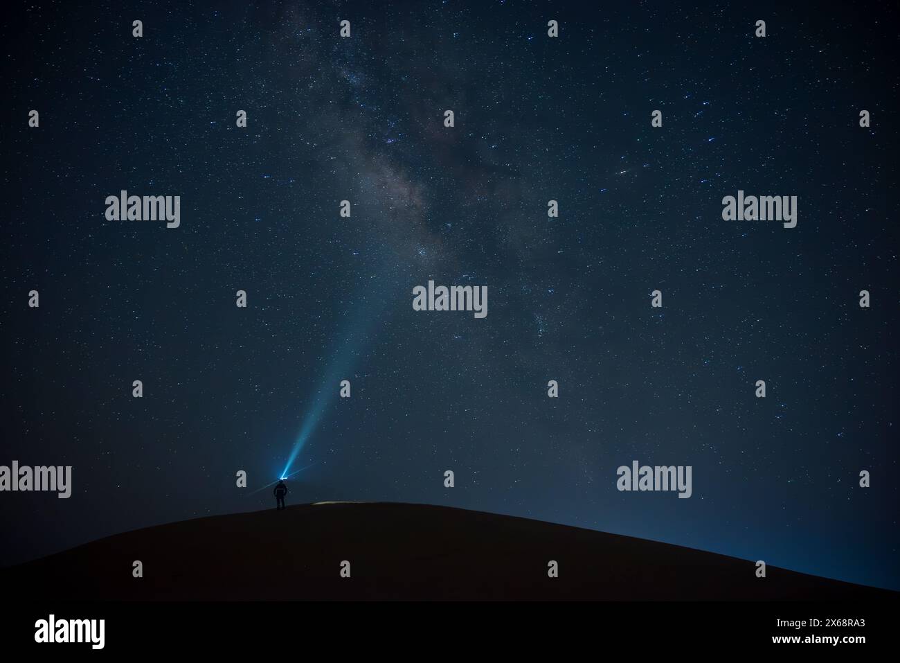 Milky way and the lighting beam Stock Photo - Alamy