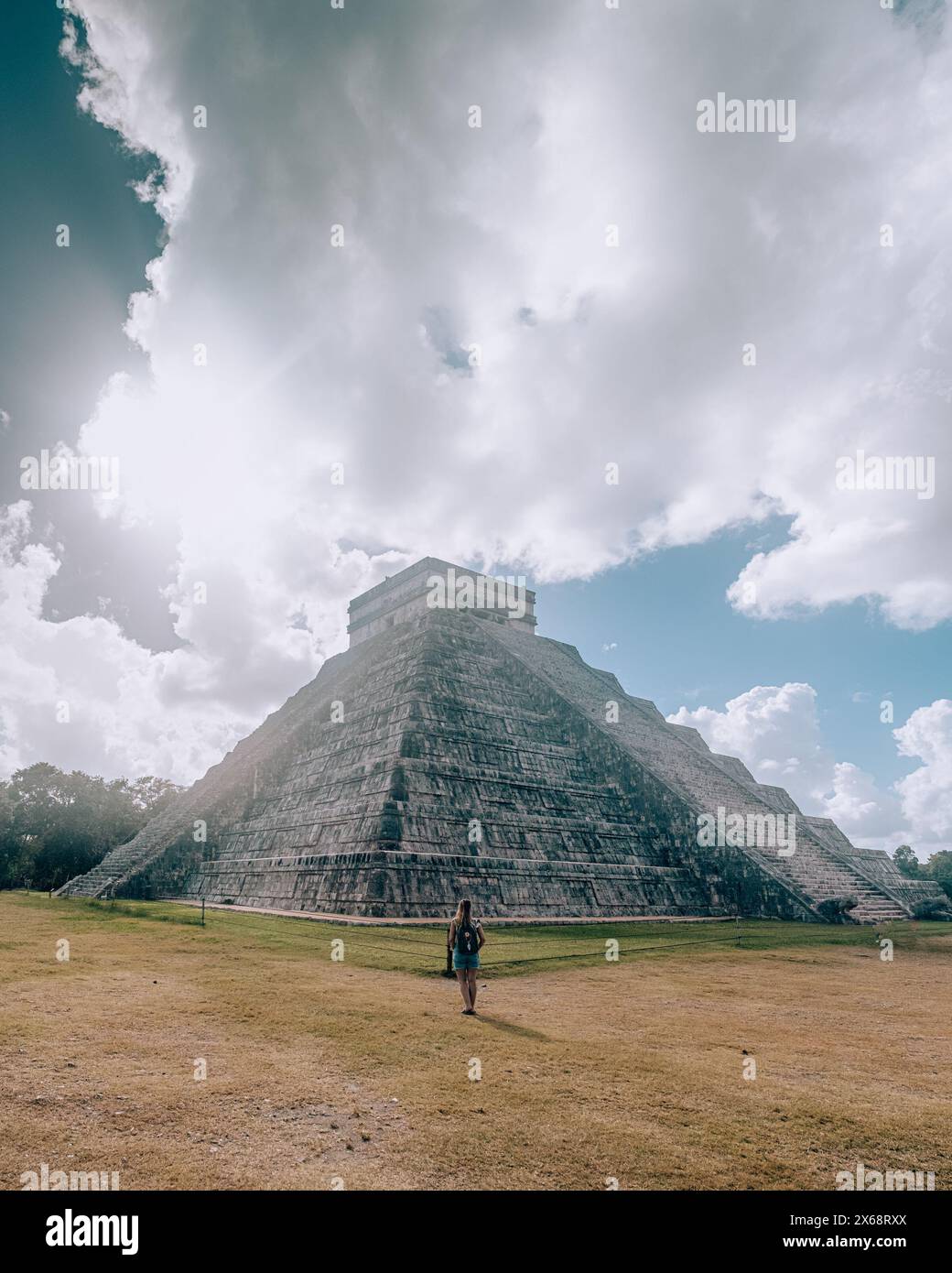 Woman touring El Castillo pyramid at Chichen Itza, Tulum Stock Photo ...